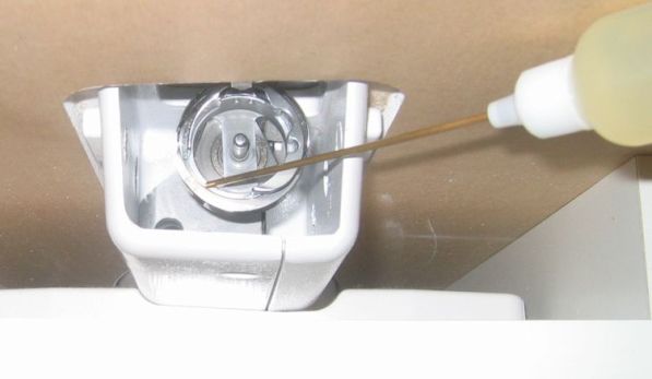 Oiling the bobbin area on the Handi Quilter Sweet Sixteen | Rhonda ...